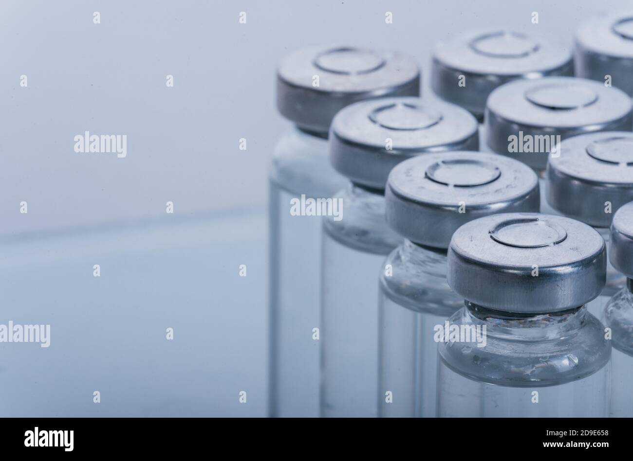 Glass medical ampoule vial for injection. Medicine is dry white drug ...