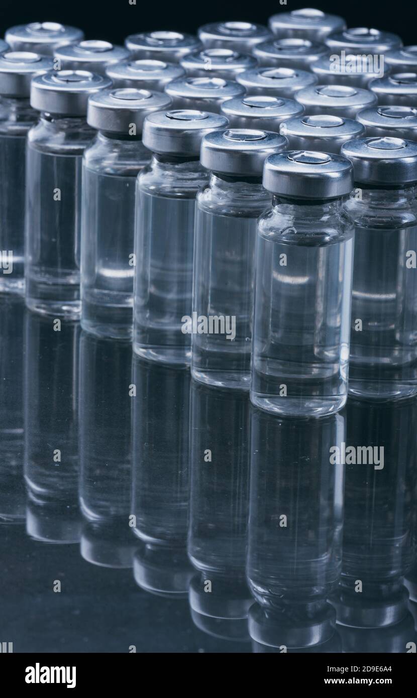 Glass medical ampoule vial for injection. Medicine is dry white drug ...