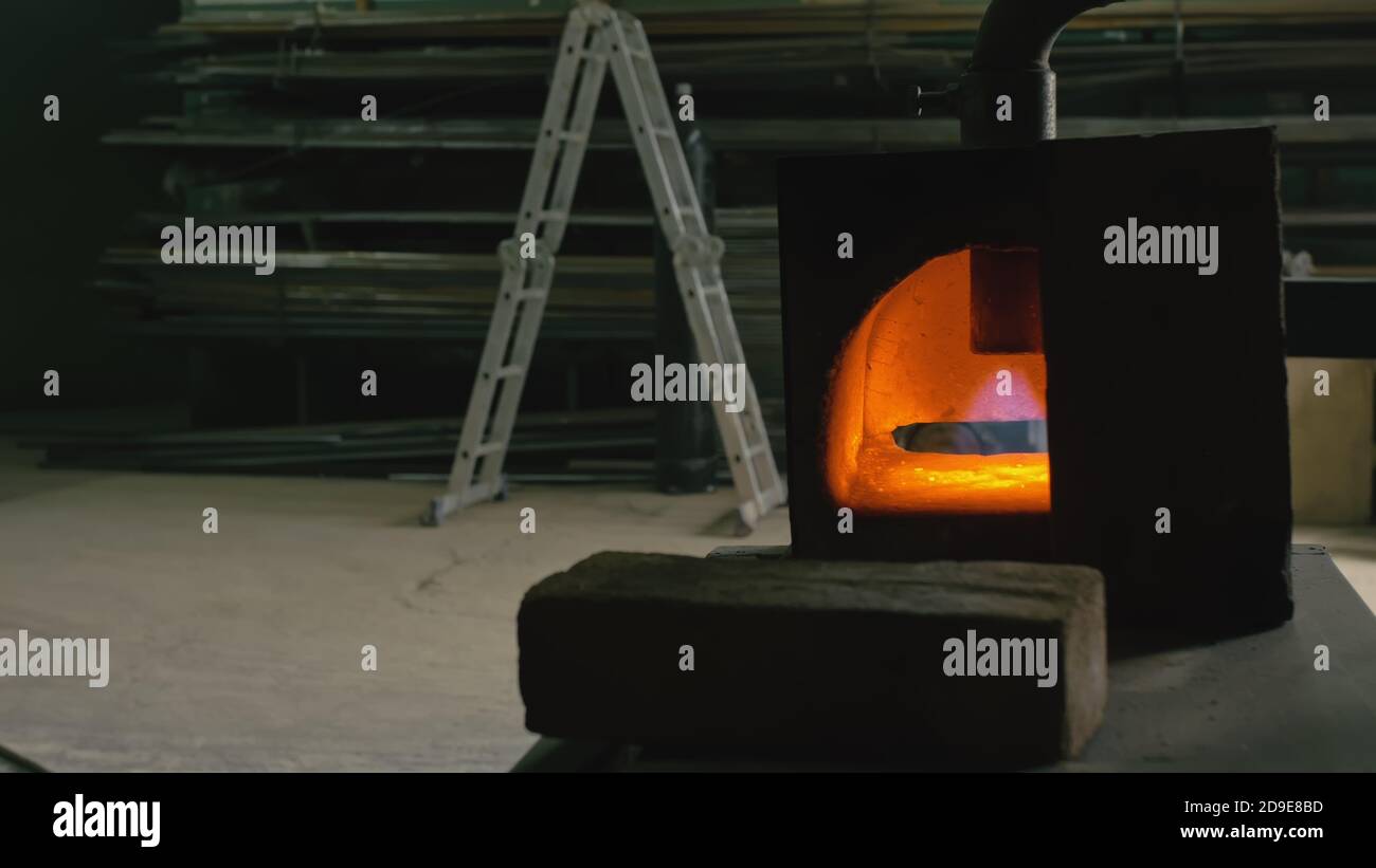 Forge workshop. Smithy manual production. Gas furnace for heating metal ...