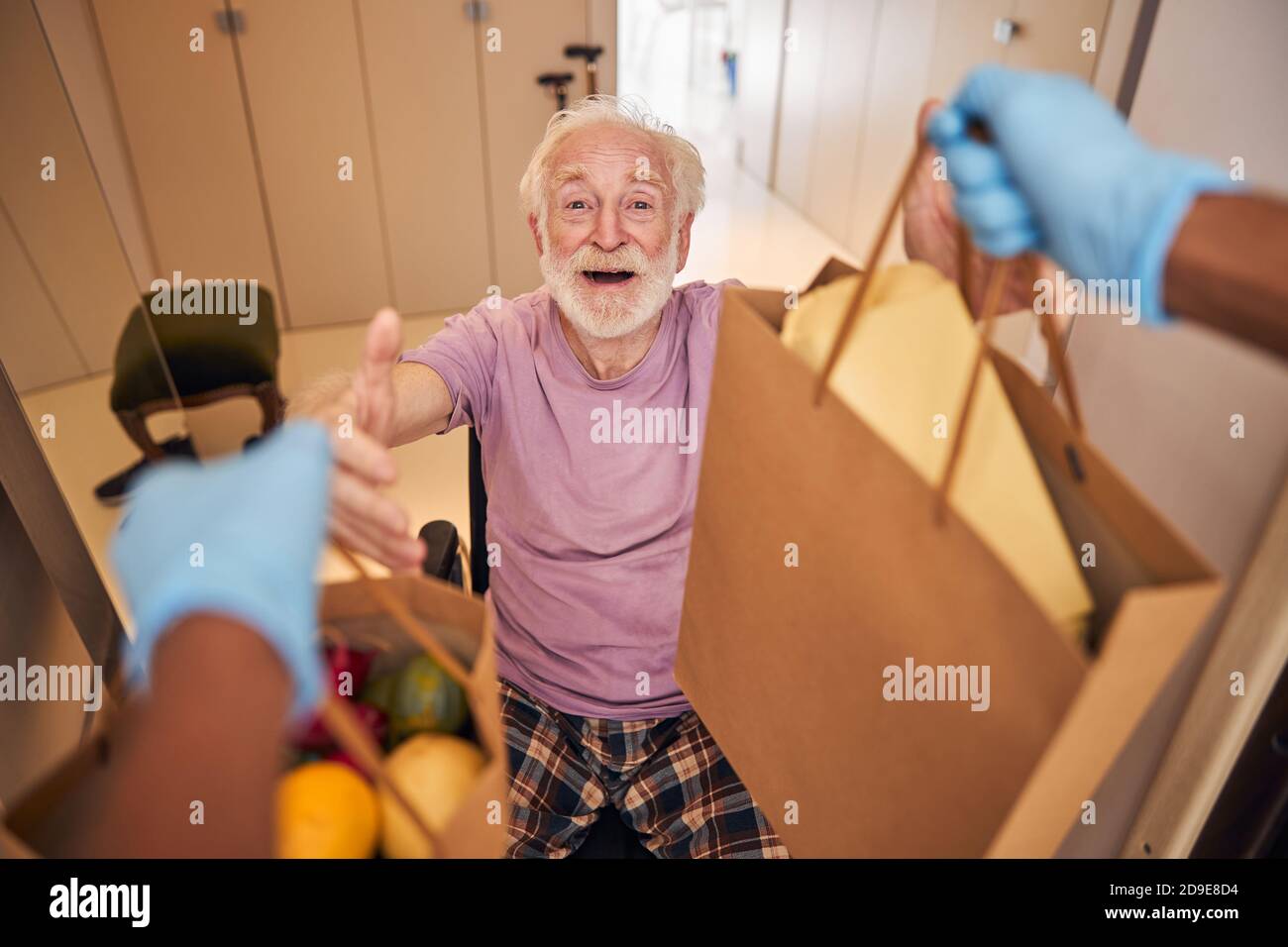 Happy senior man rejoicing at the food delivery Stock Photo - Alamy