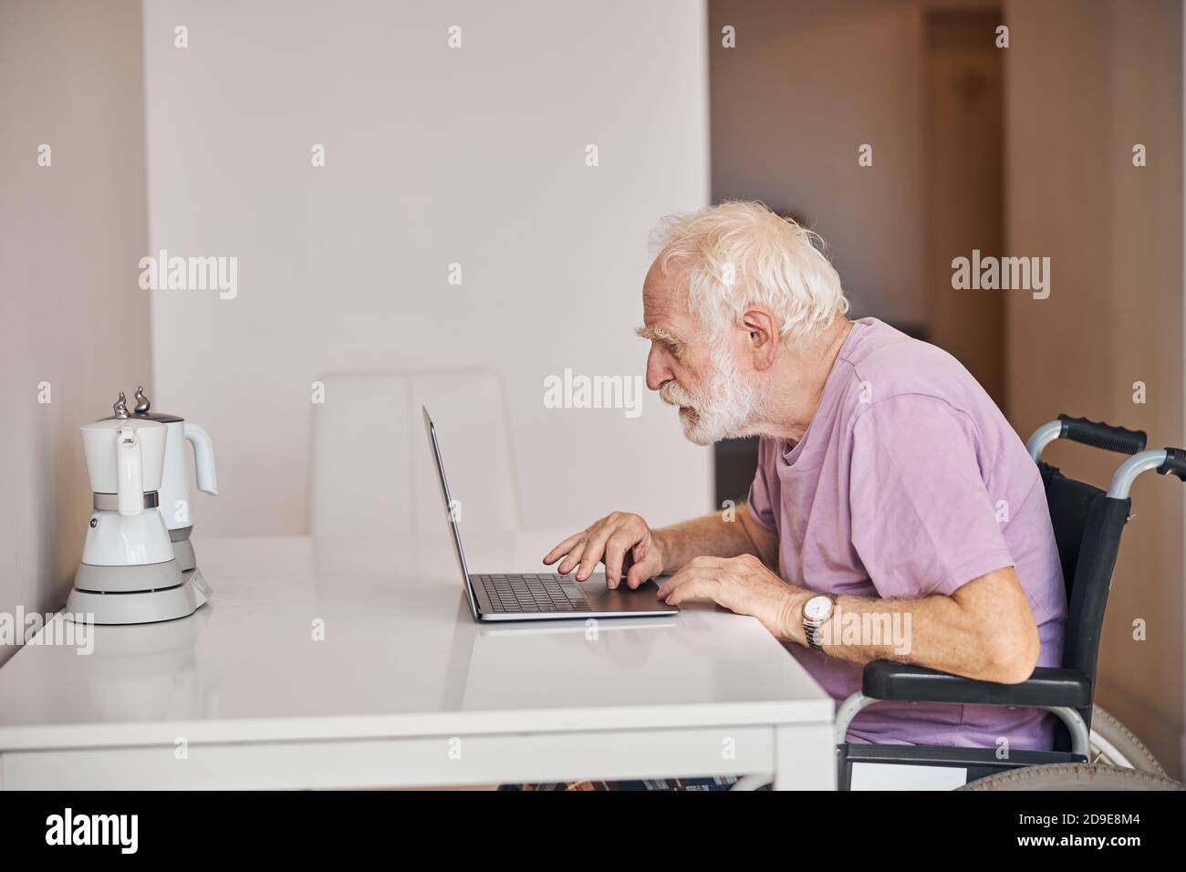 Old man writing email hi-res stock photography and images - Alamy