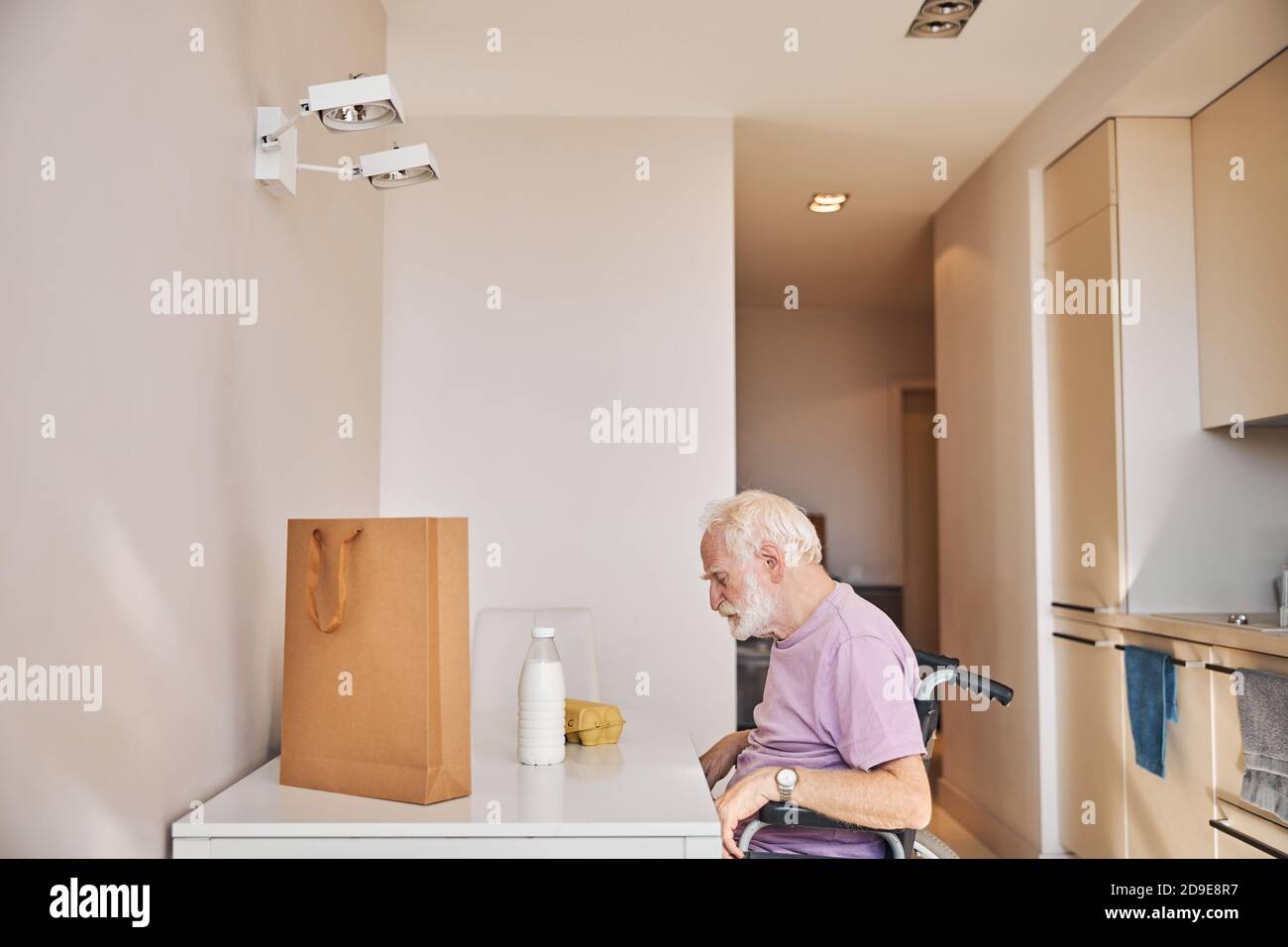 Elderly person dozing off in the wheelchair Stock Photo - Alamy