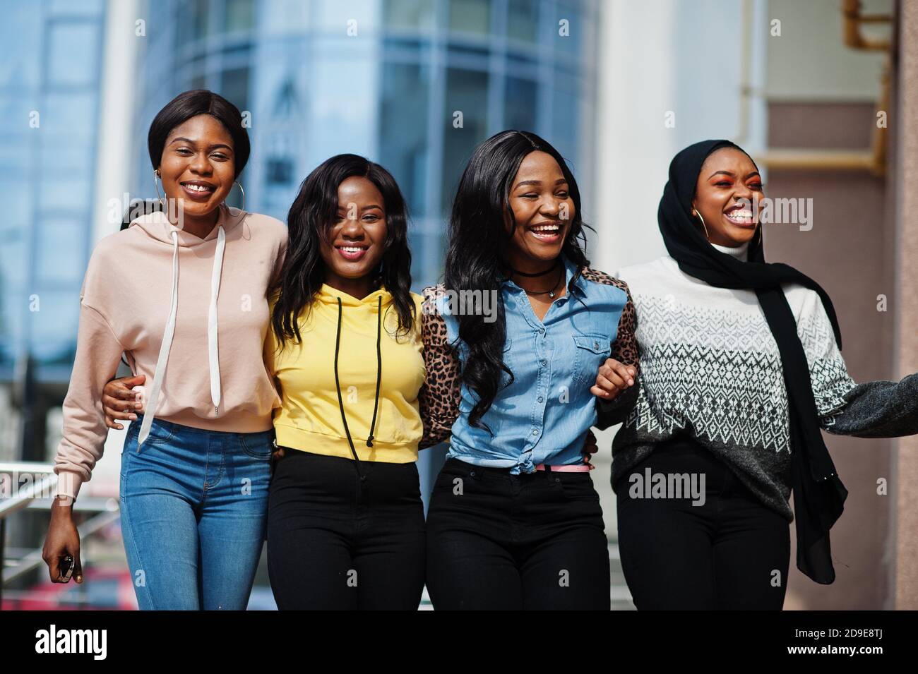 Four young college african american woman friends spend time together ...