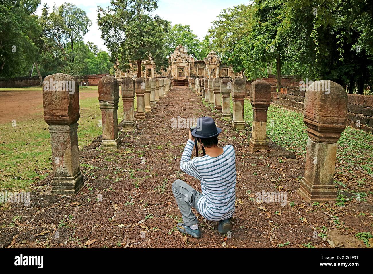 Young Man Taking Photos of Prasat Sdok Kok Thom Khmer Temple Complex ...