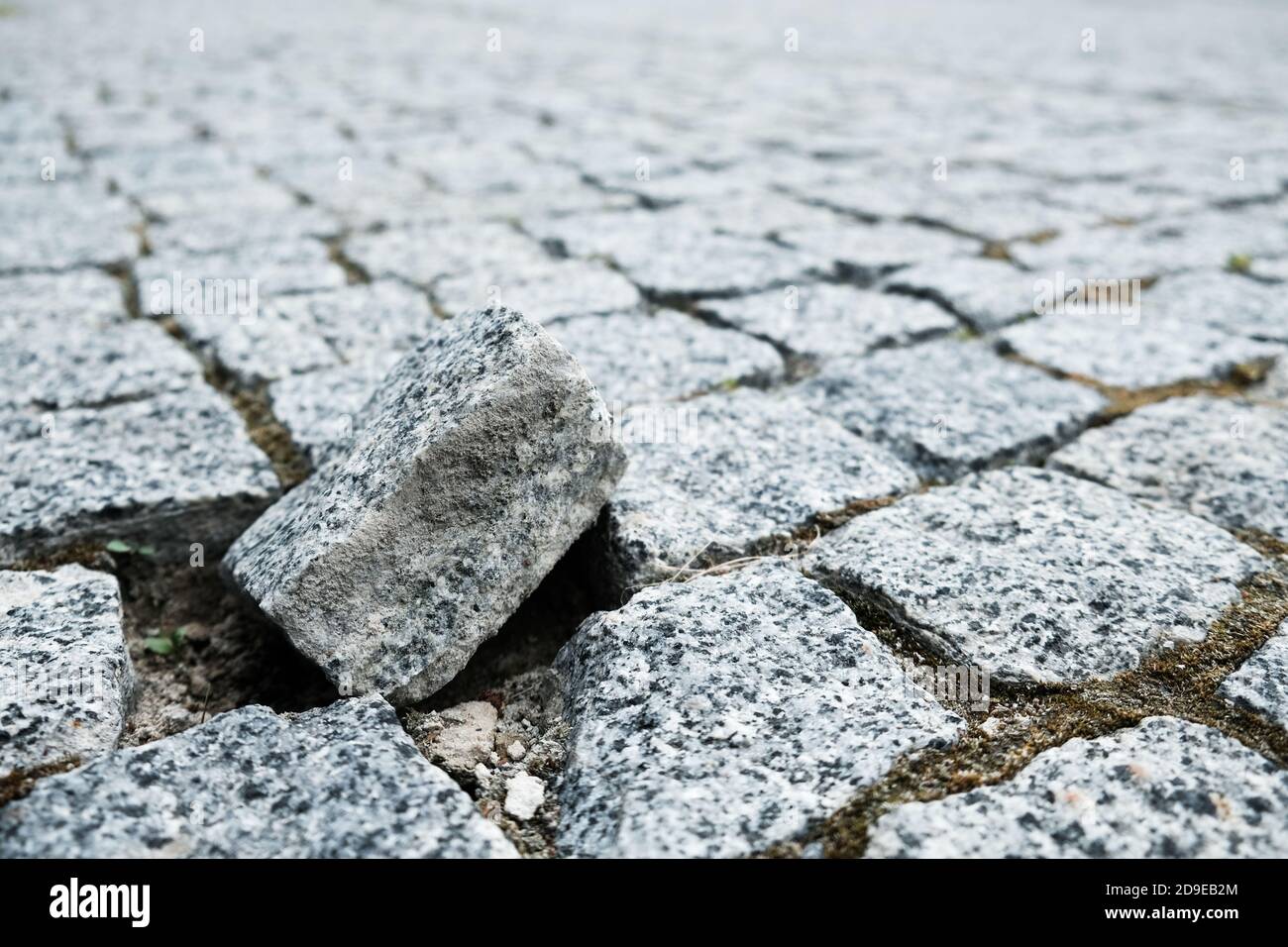 Broken piece of cobblestone street in an old medieval city. Paved ...