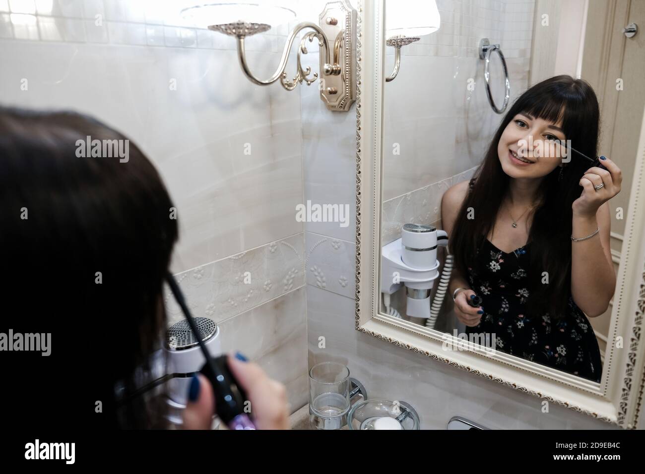 Happy Young Woman Applying Mascara In Front Of A Mirror Girl Getting 3682