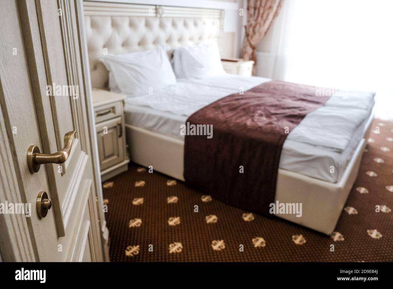 Luxury hotel room on a tourist retreat. Entering the suite, door open ...