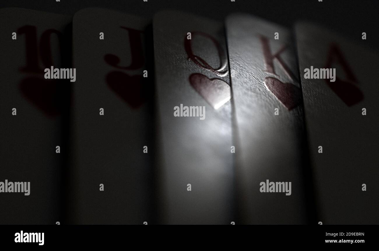 A close up of fanned out royal flush suit of five casino playing cards ...