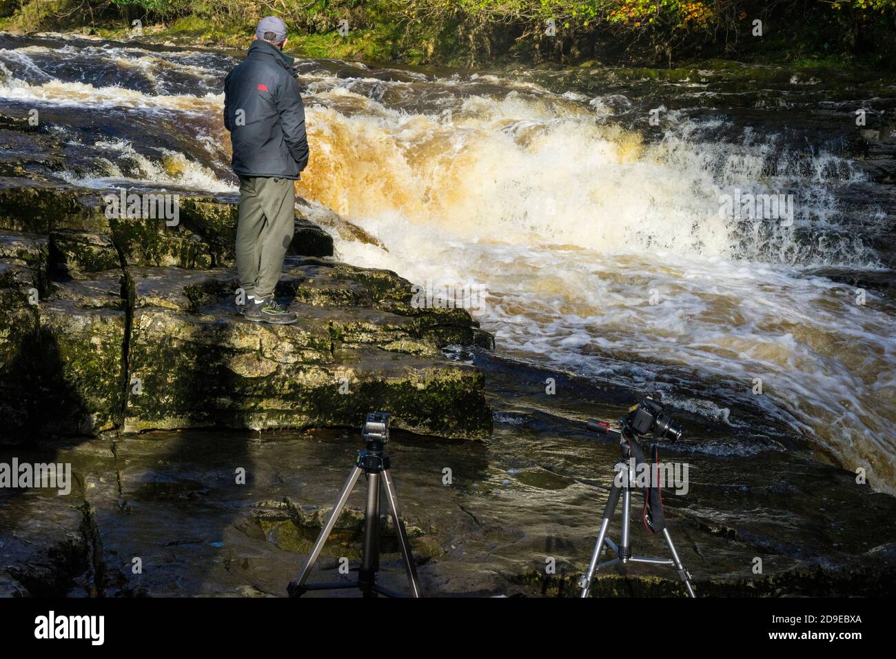 Photographer setting up to film the Salmon run at Stainforth Force ...