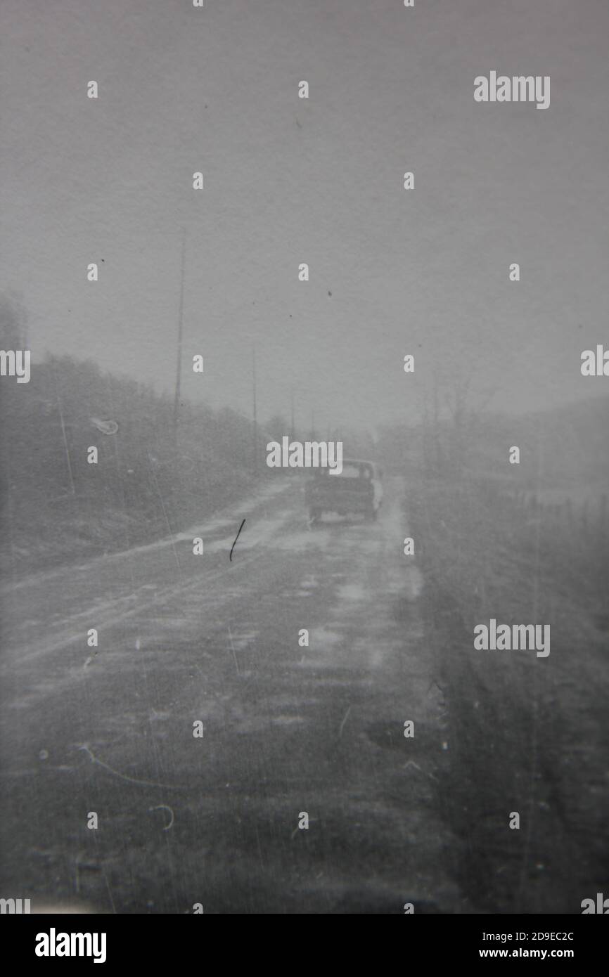 Fine 1970s vintage black and white photography of an empty country lane ...