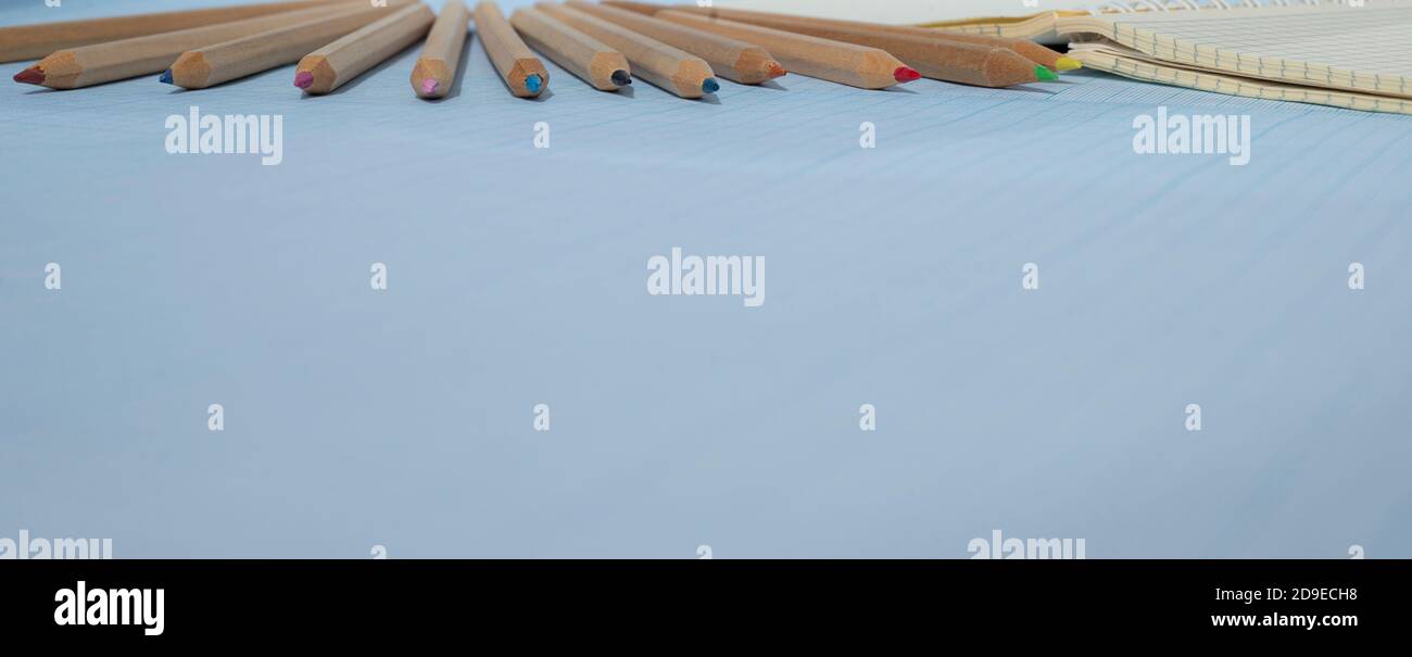 Banner frame made of wooden pencils with bright colored leads. Blue ...