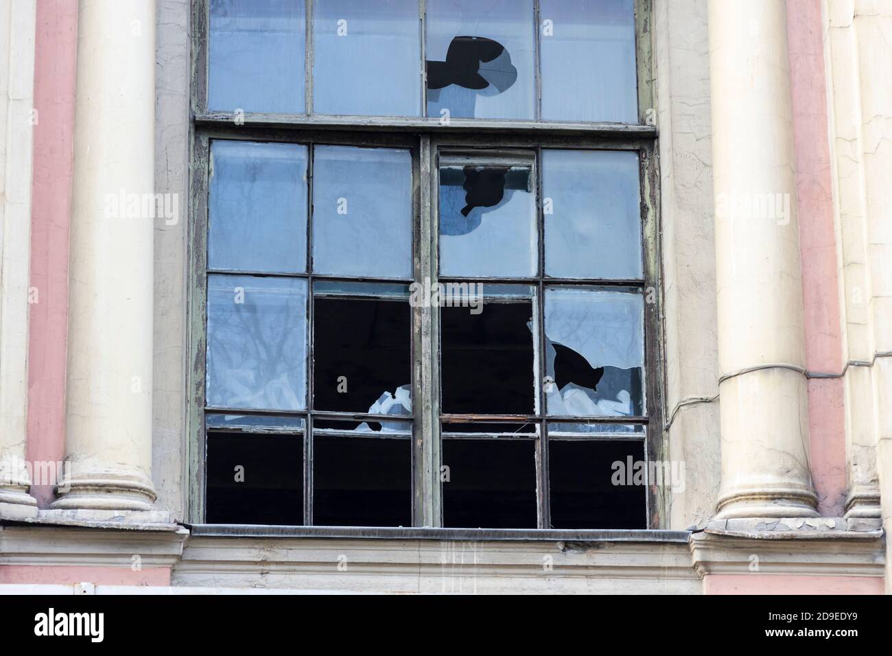 Broken windows in an old abandoned building about to be demolished ...