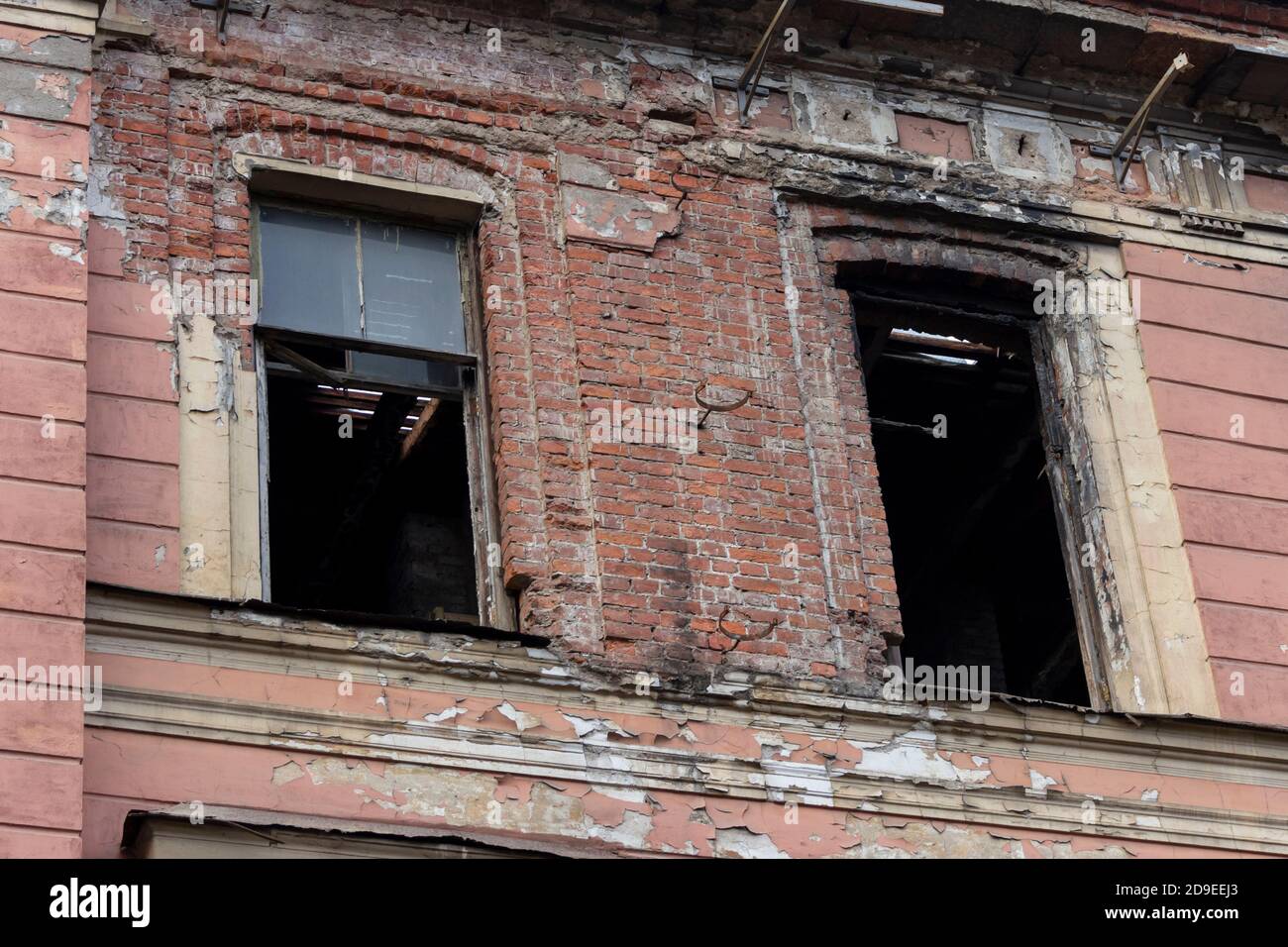 Broken windows in an old abandoned building about to be demolished ...