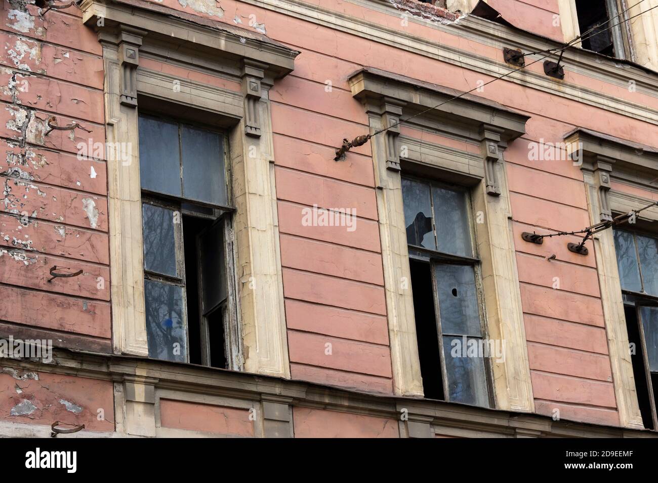 Broken windows in an old abandoned building about to be demolished ...