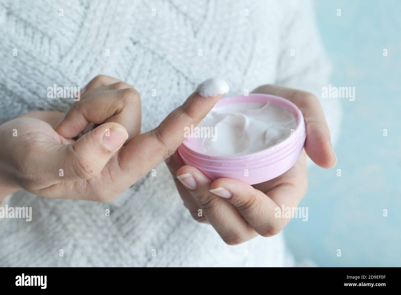 woman applying beauty cream onto skin at home Stock Photo - Alamy