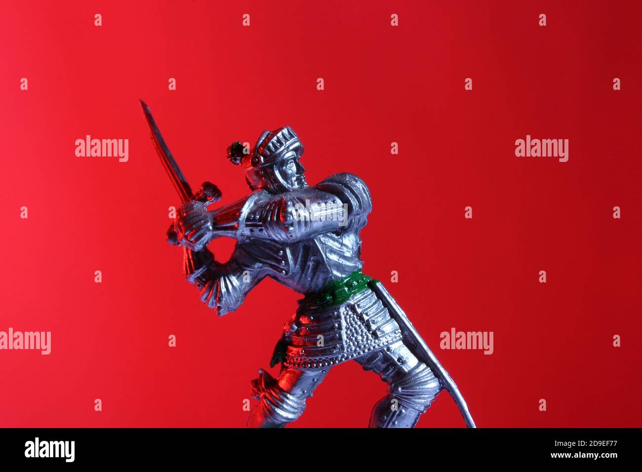 medieval knight toy on red background Stock Photo - Alamy