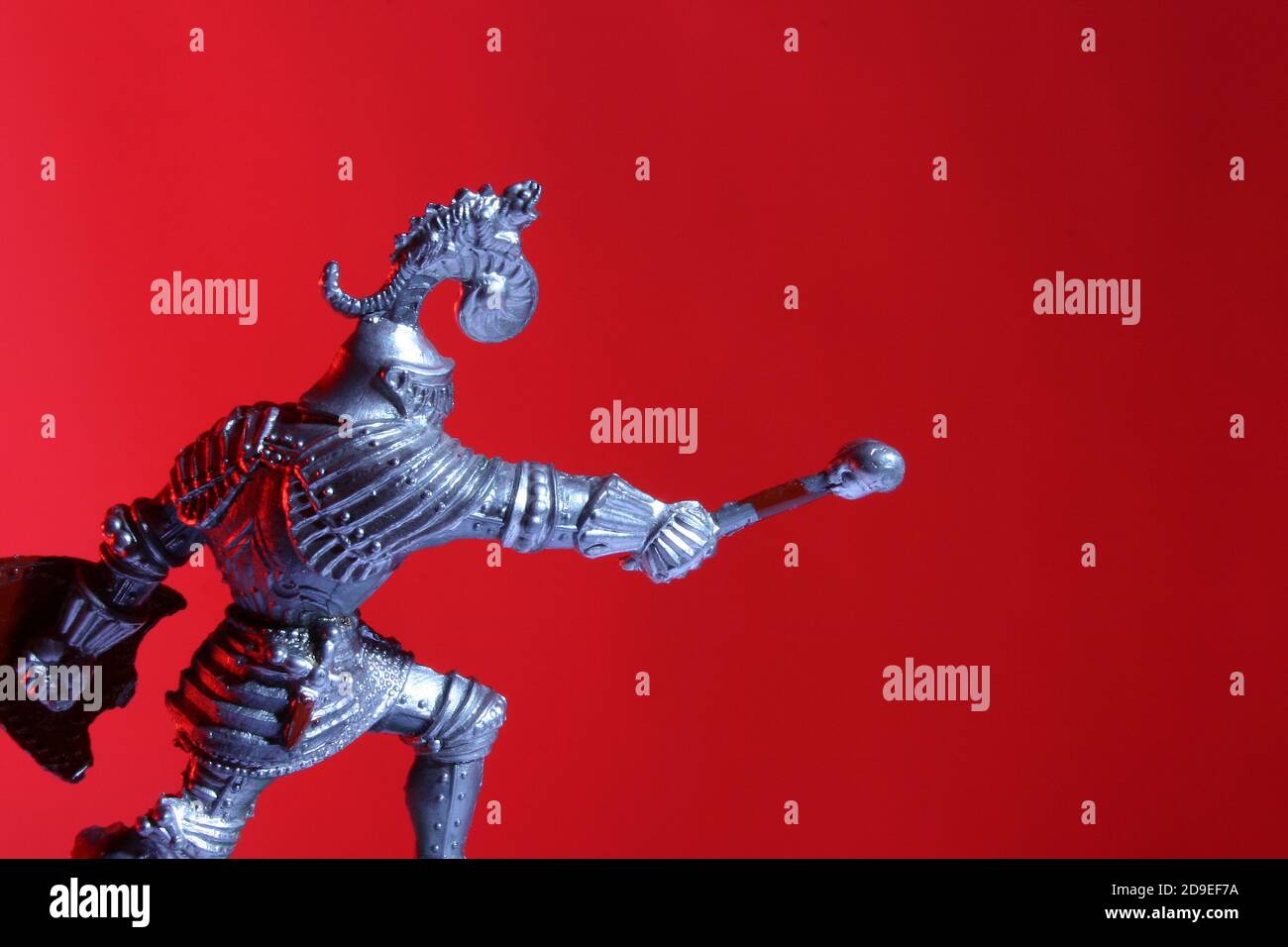 medieval knight toy on red background Stock Photo - Alamy