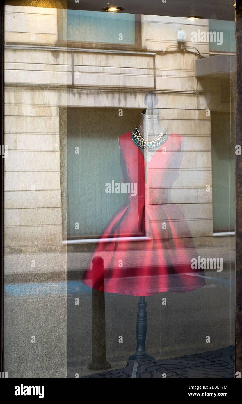 Red dress at fashion shop exhibition window Stock Photo - Alamy