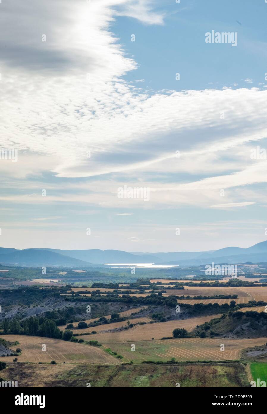 Mountains and stream flowing on vertical countryside landscape Stock ...
