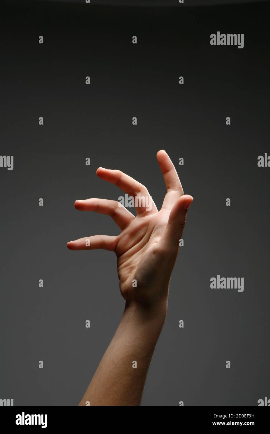 Hand gesture isolated on a grey background Stock Photo - Alamy