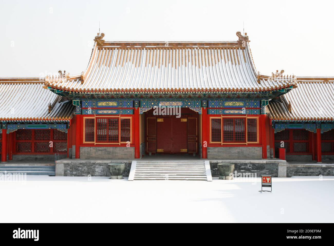 Snow covered red chinese building in Beijing Stock Photo - Alamy