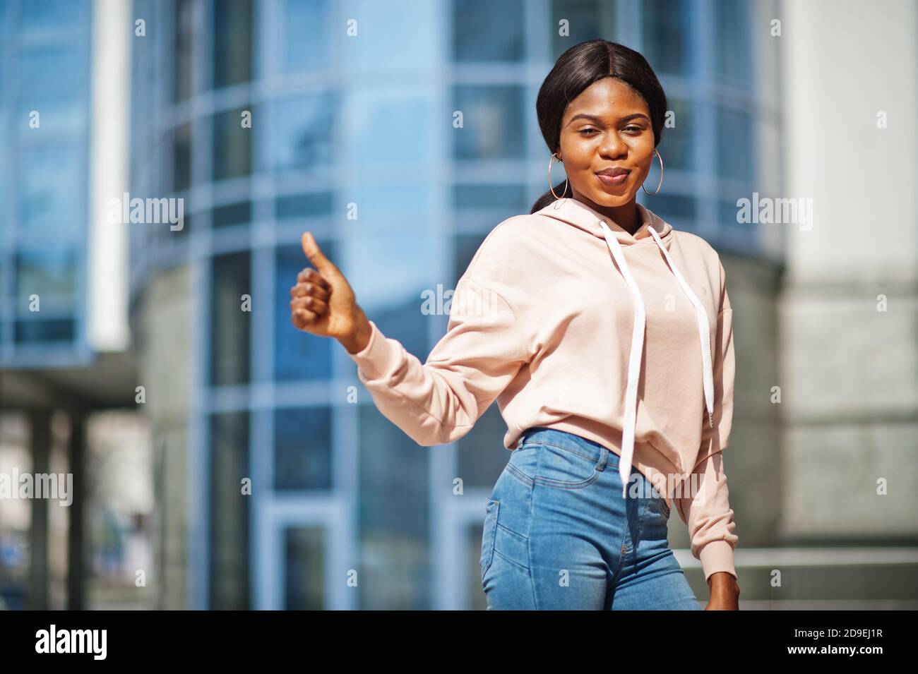 Hipster African American Girl Wearing Pink Hoodie Jeans Posing At