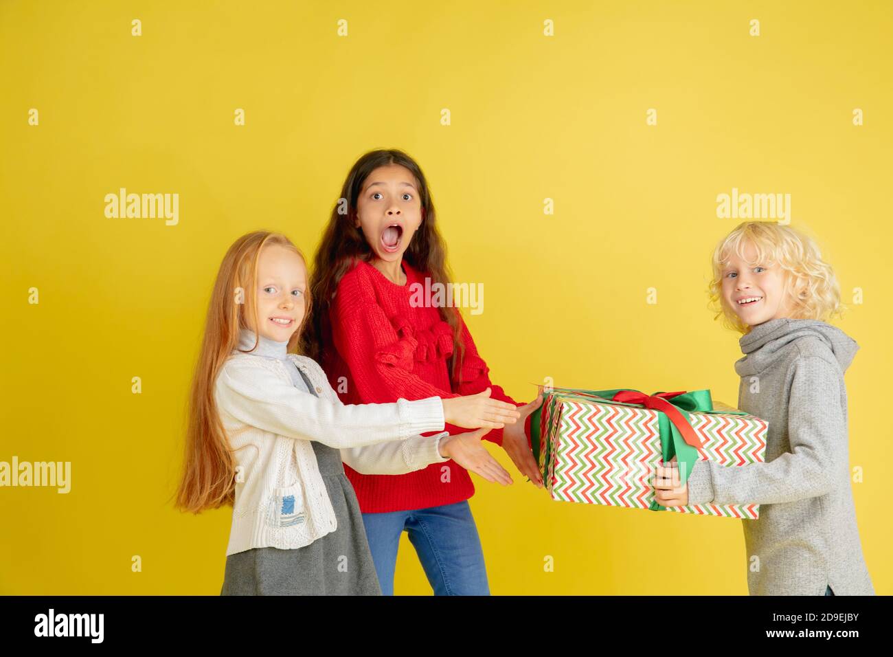 Giving and getting presents on Christmas holidays. Group of happy ...