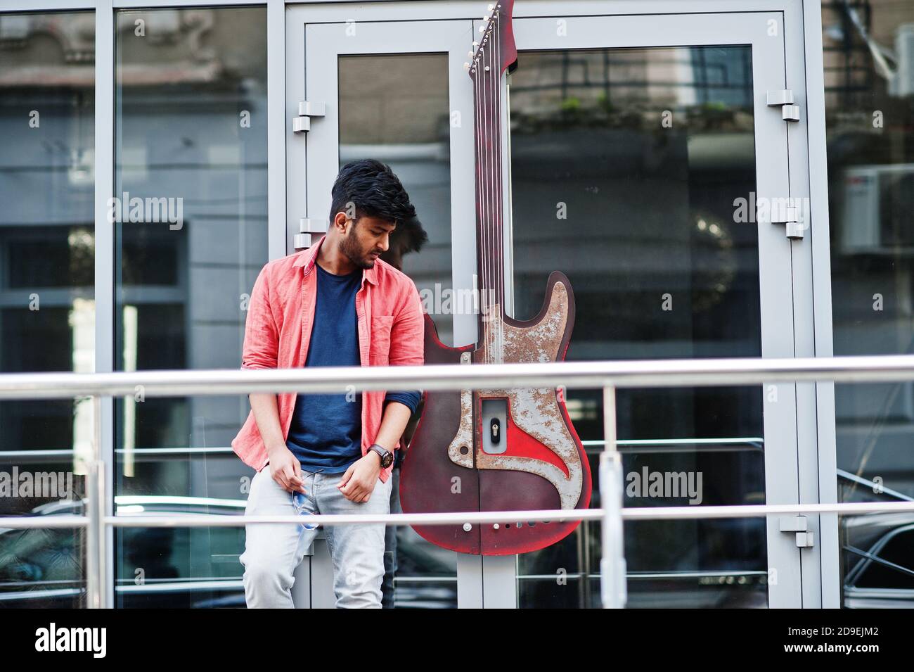 Portrait of young stylish indian man model pose in street Stock Photo ...