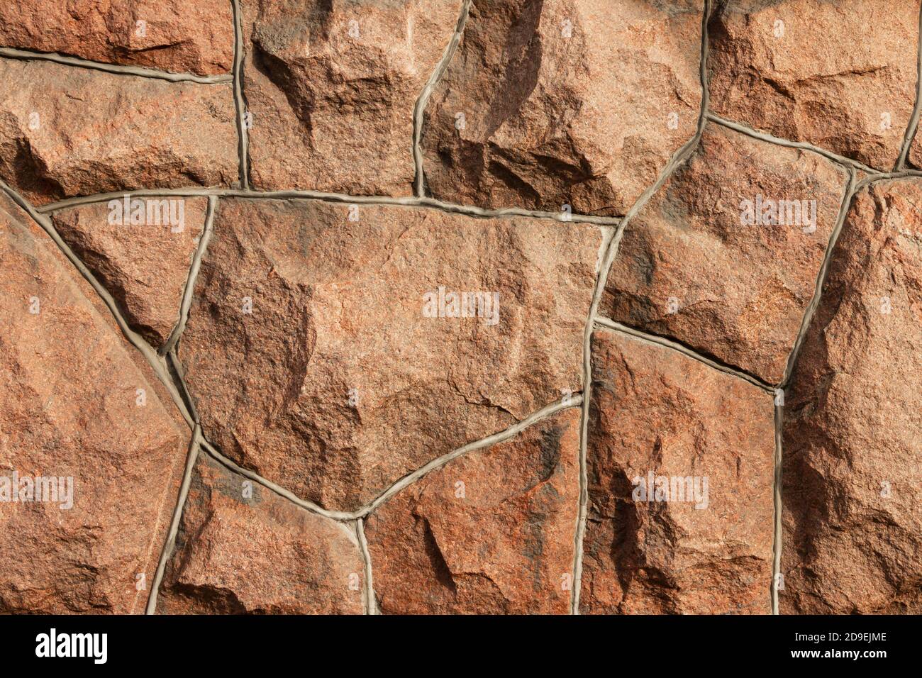 The surface of the masonry is made of roughly hewn large red stones ...