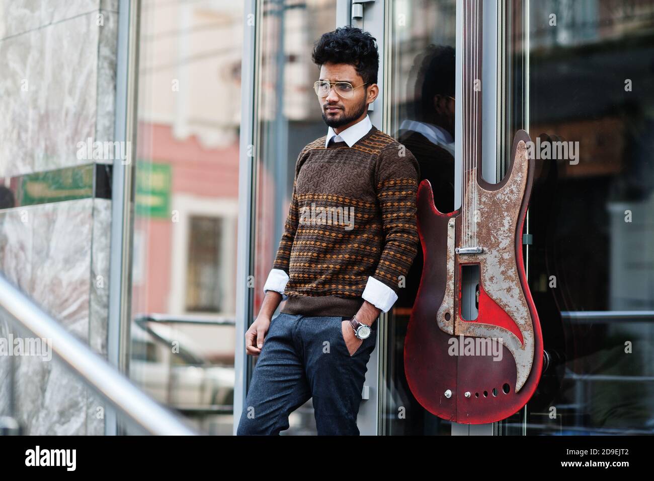 Portrait of young stylish indian man model pose in street Stock Photo ...