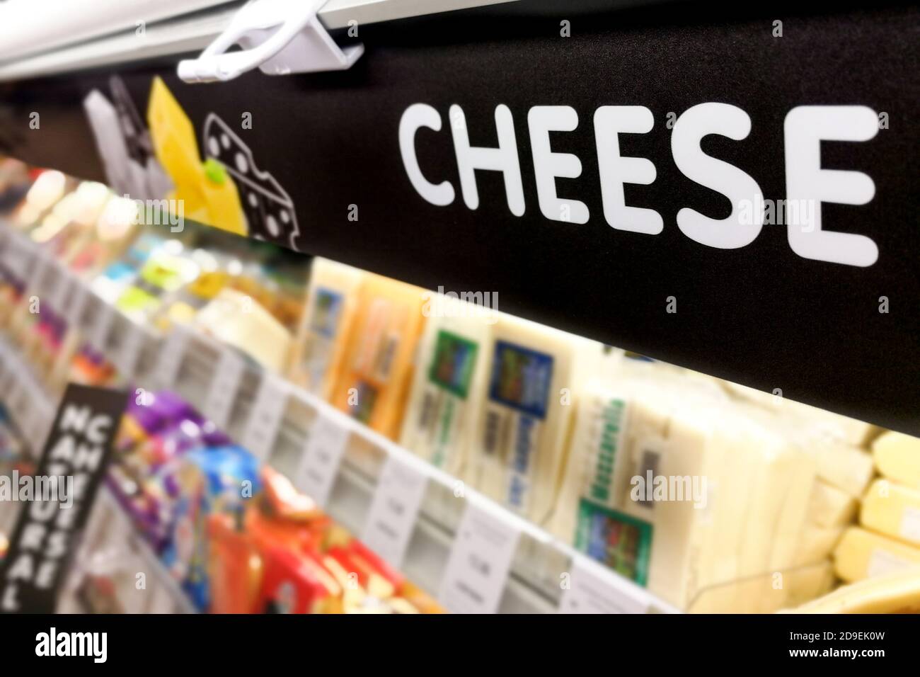 Cheese signage at the fresh chiller refrigerated section of supermarket ...