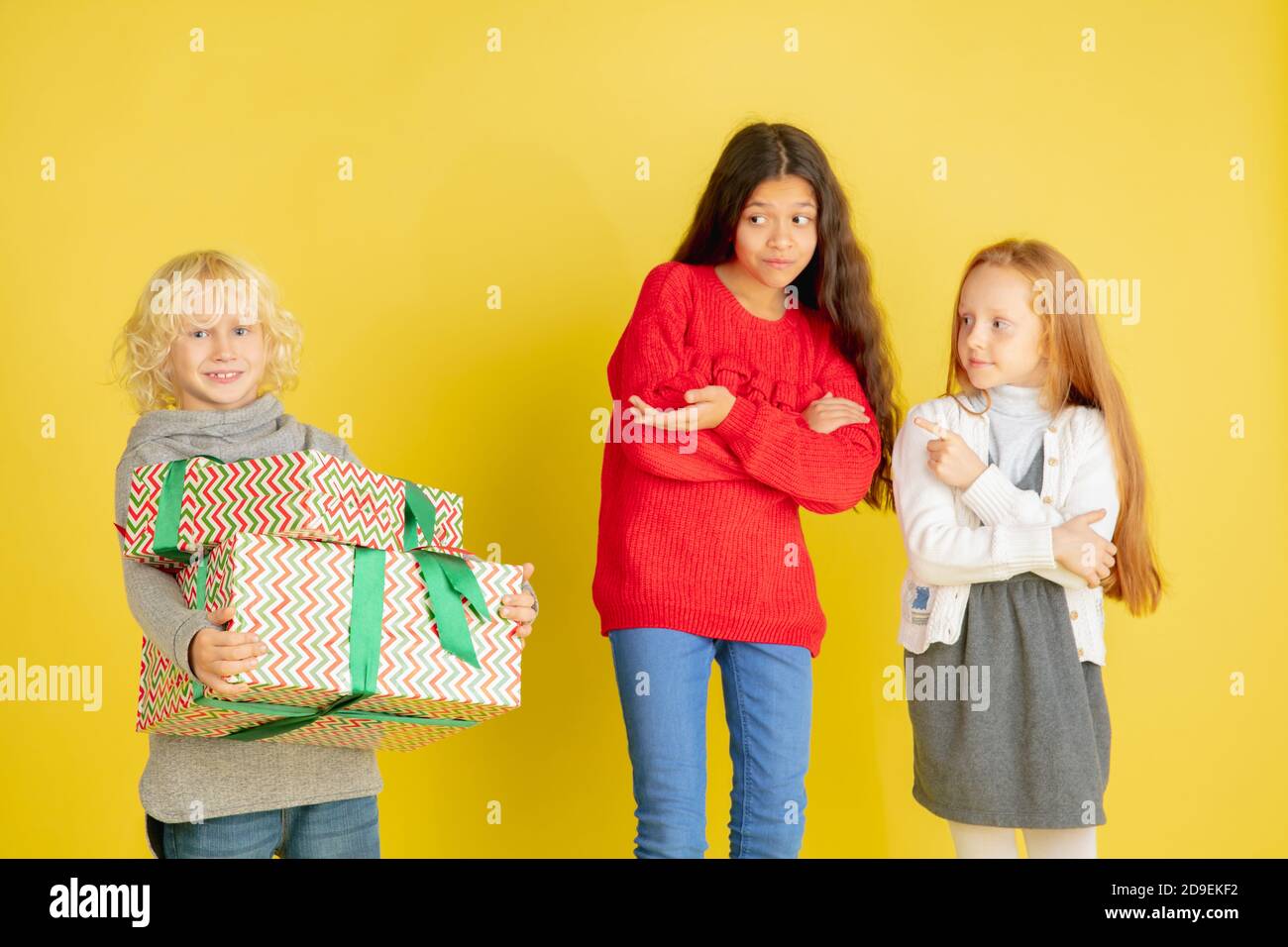 Giving and getting presents on Christmas holidays. Group of happy ...