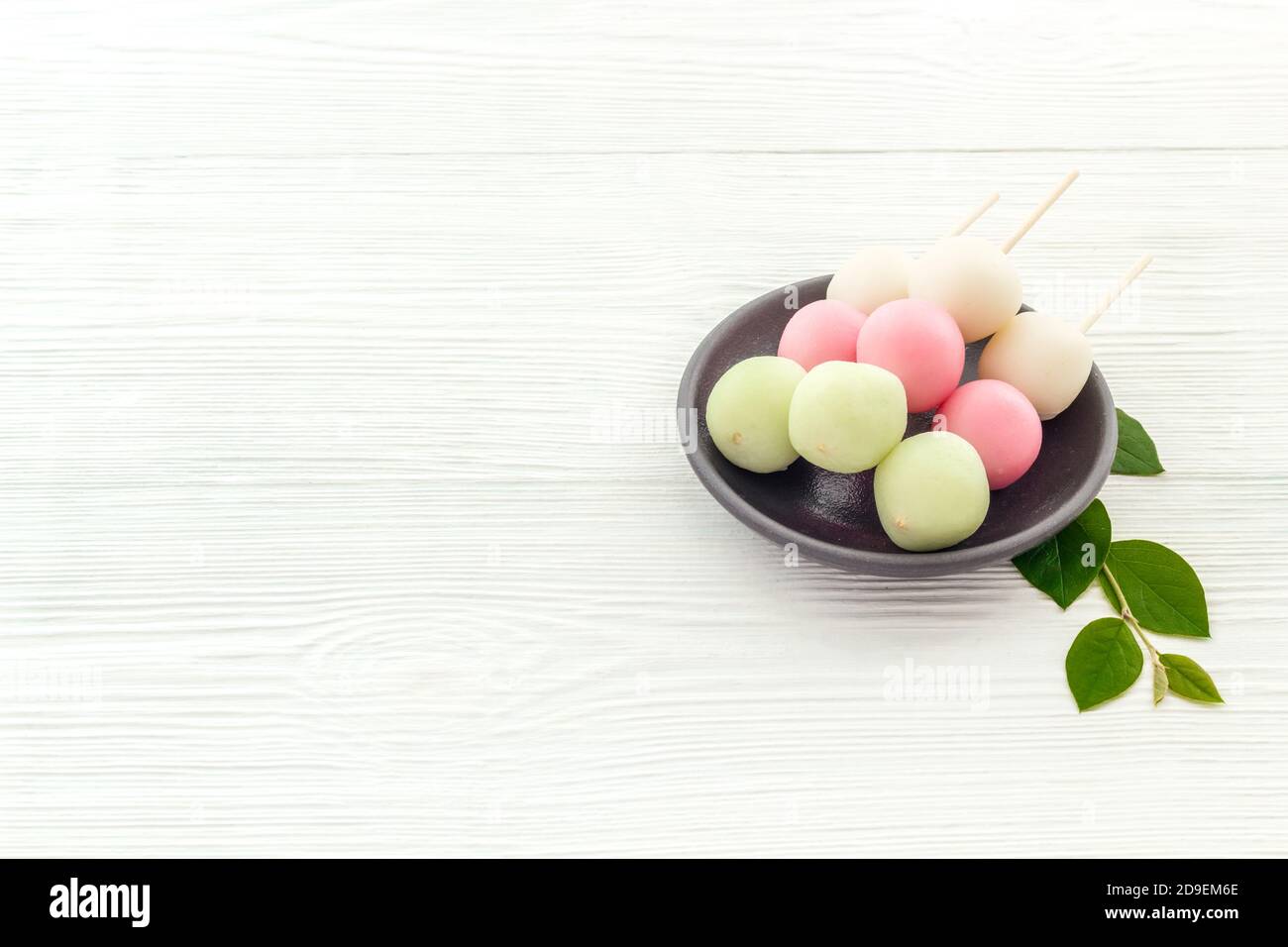 Japanese Dango dessert in pink, white and green colors, copy space ...