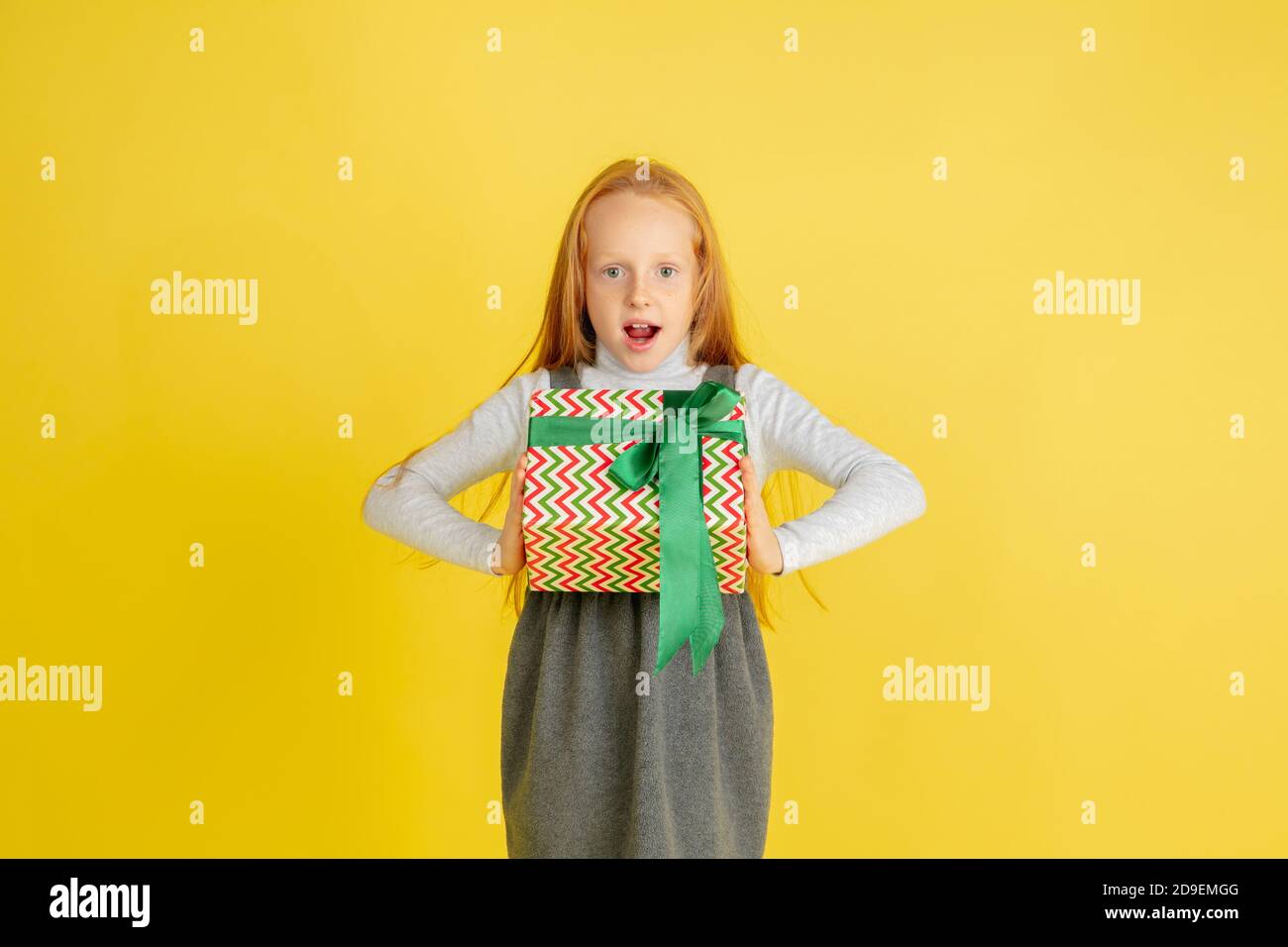 Giving and getting presents on Christmas holidays. Teen smiling girl ...