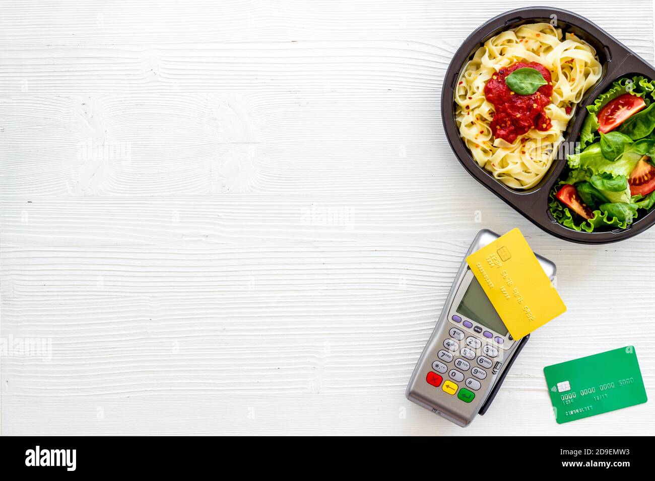 Food delivery payment with terminal and lunch boxes with meal Stock ...