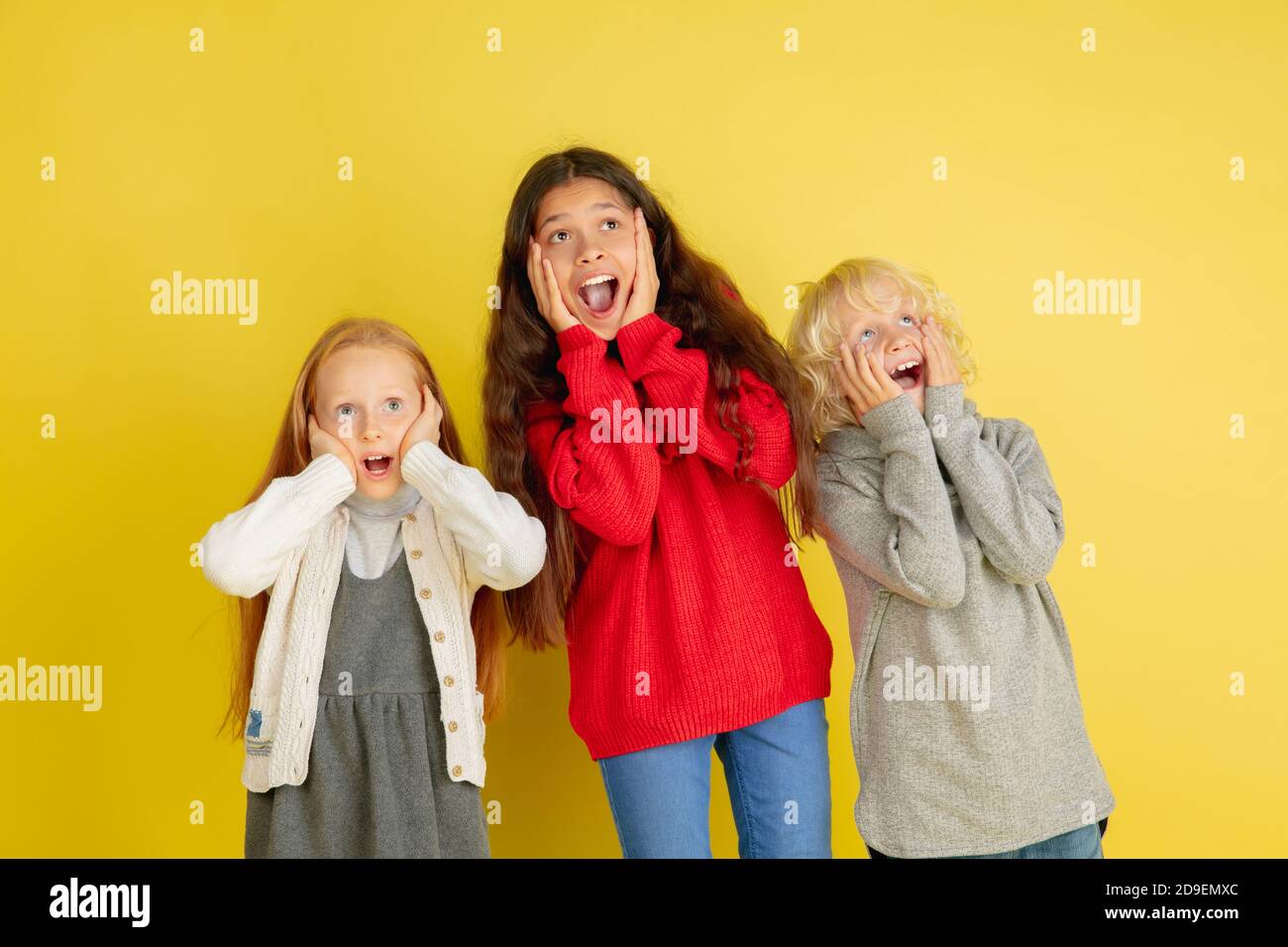 Shocked, astonished. Portrait of little caucasian children isolated on ...