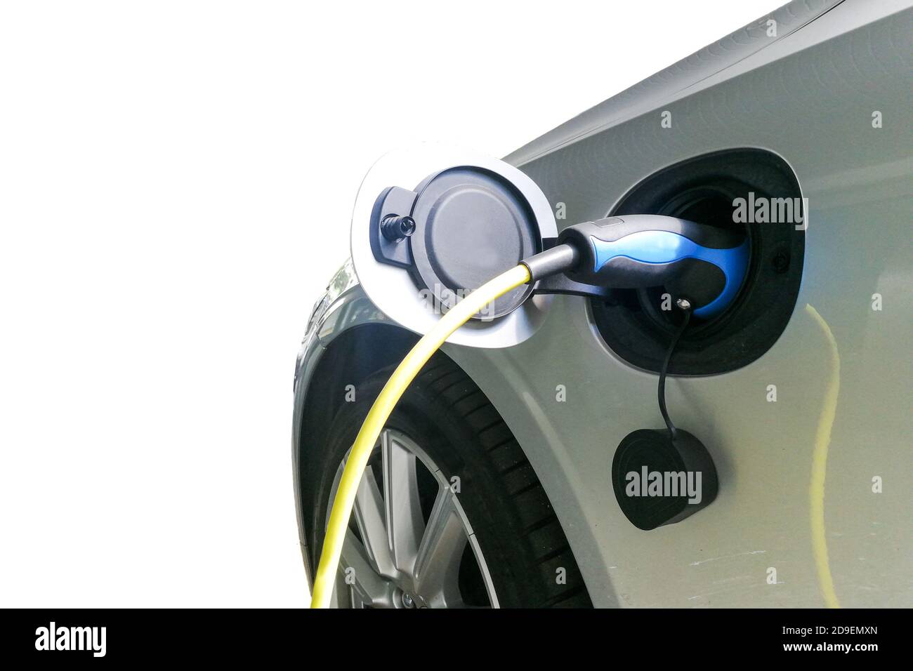 Closeup of electric hybrid car being charged with socket Stock Photo ...