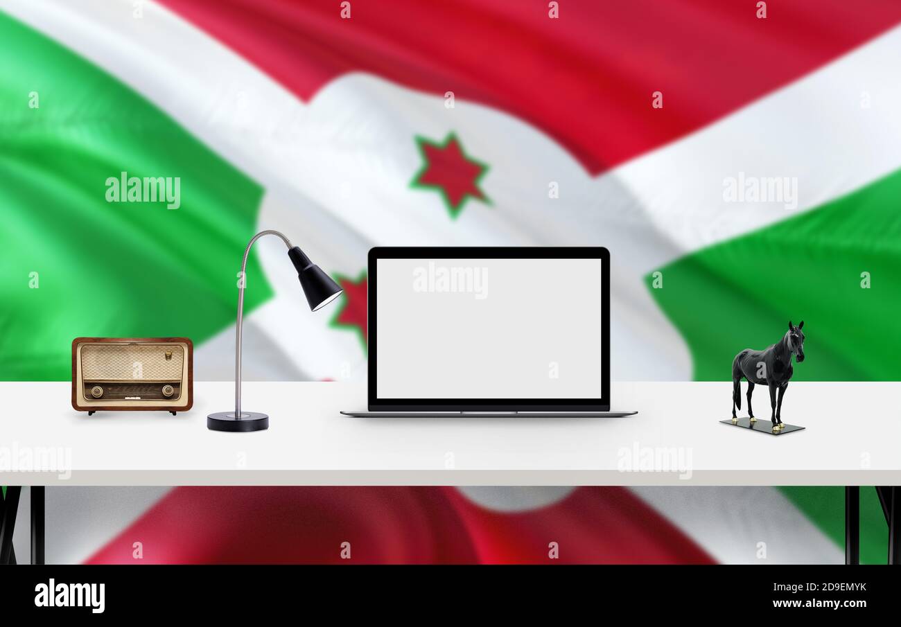 Burundi national flag background with workspace, desktop computer and ...