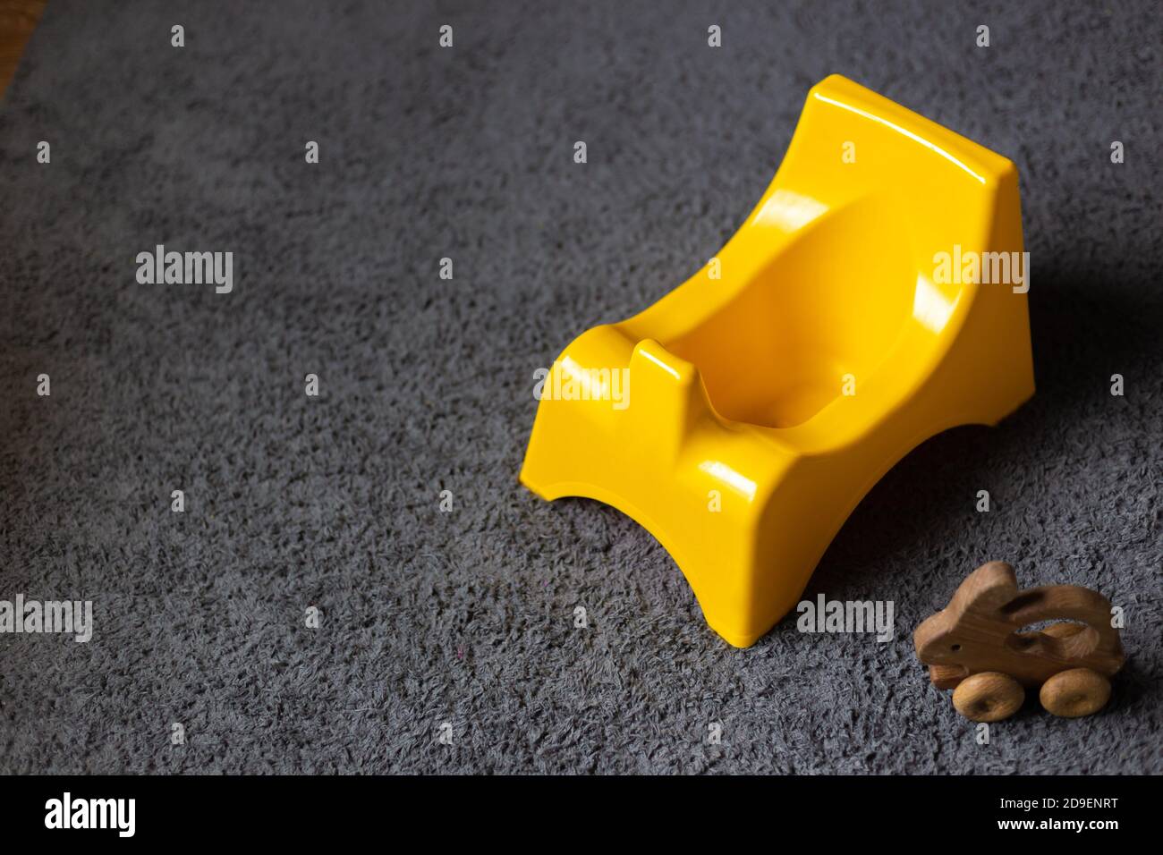 Modern blue potty on floor in room. Toilet training Stock Photo - Alamy