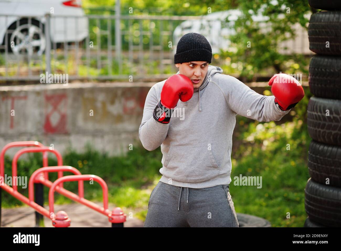Man arabian boxer in hat training for a hard fight outdoor gym Stock ...