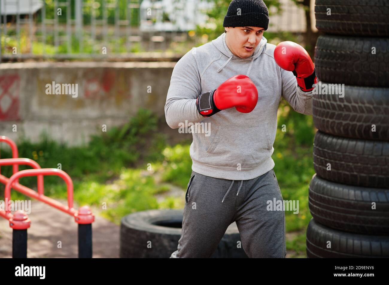 Man arabian boxer in hat training for a hard fight outdoor gym Stock ...