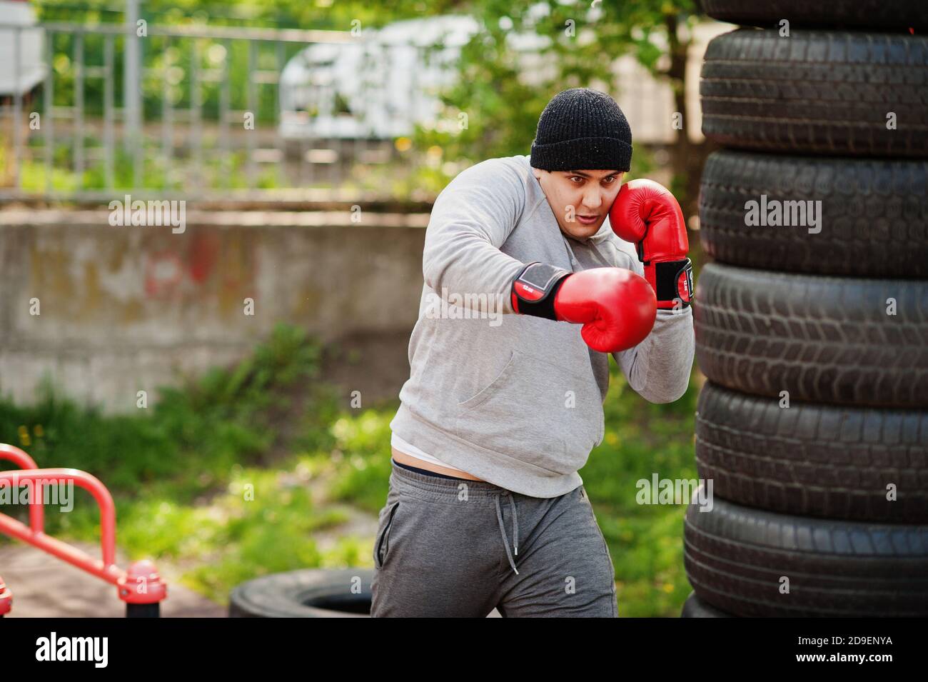 Man arabian boxer in hat training for a hard fight outdoor gym Stock ...