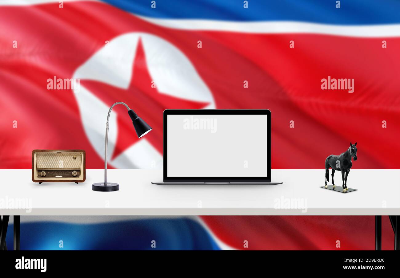 North Korea national flag background with workspace, desktop computer ...