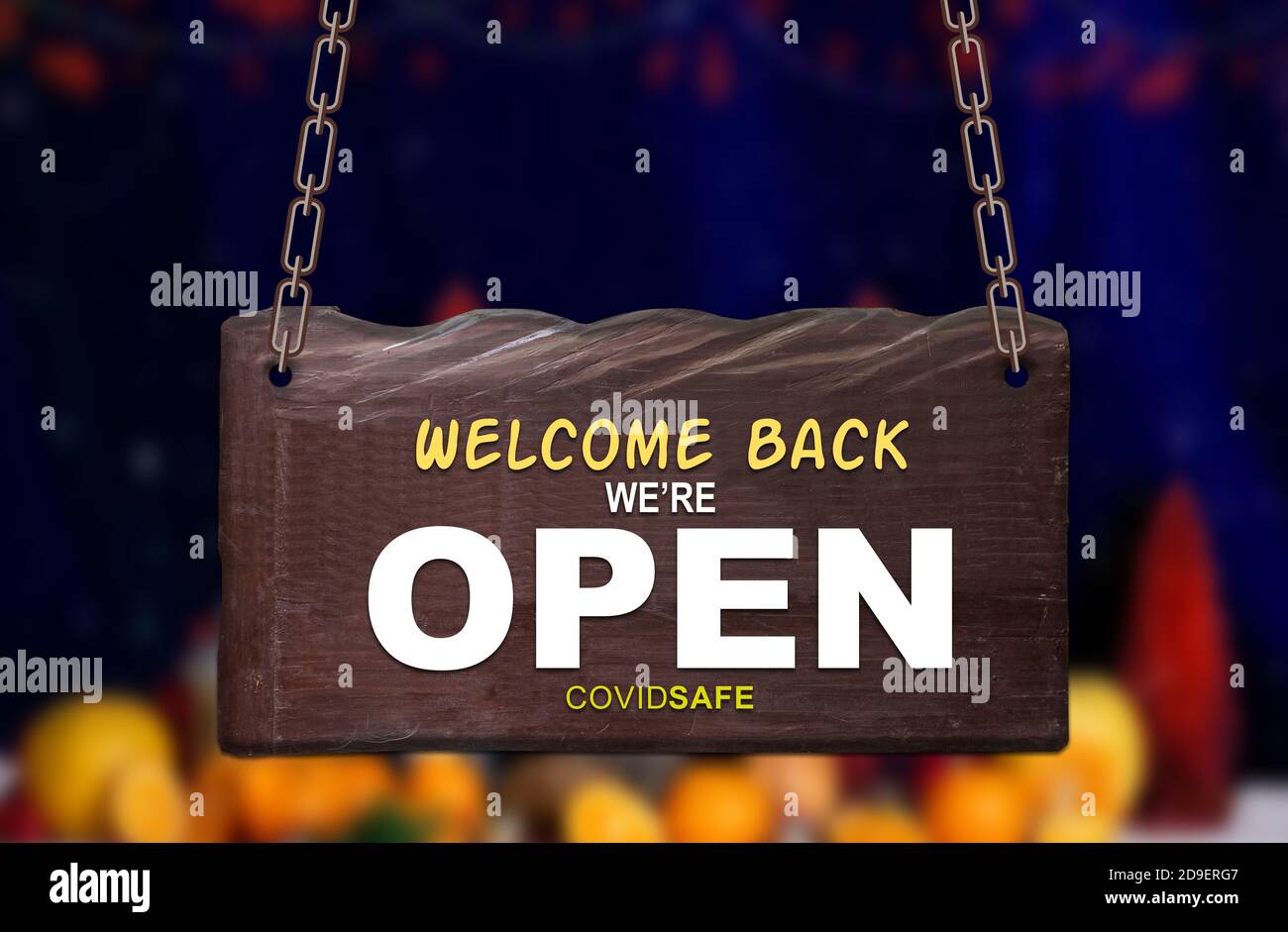 Welcome back we are open sign hanging outside a shop after lockdown ...