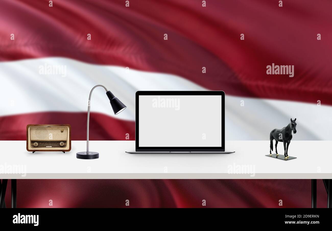 Latvia national flag background with workspace, desktop computer and ...