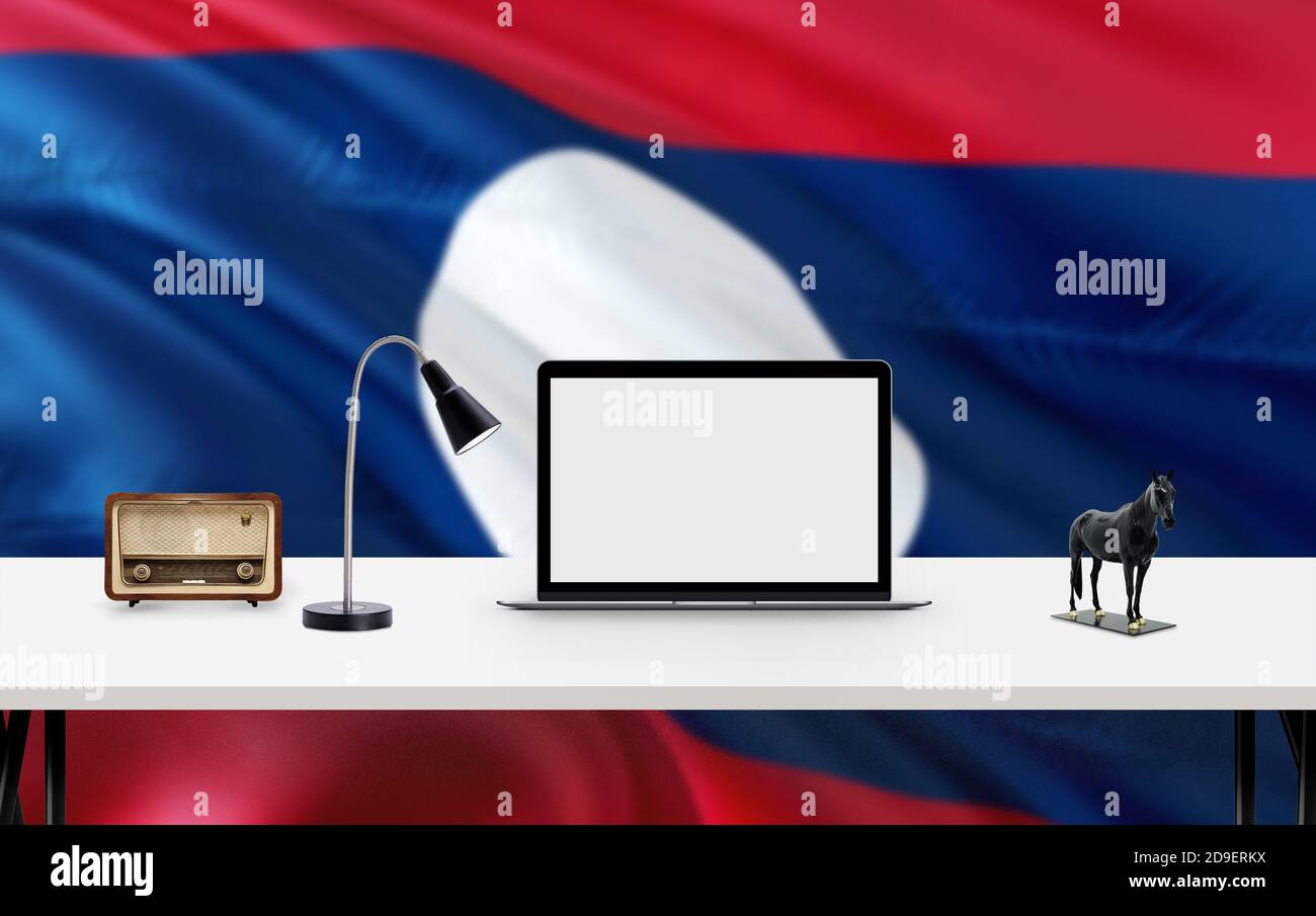 Laos national flag background with workspace, desktop computer and ...