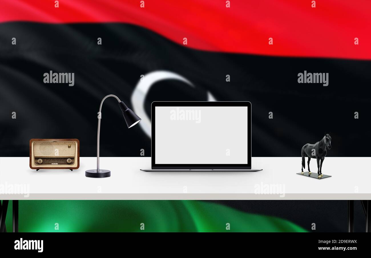 Libya national flag background with workspace, desktop computer and ...