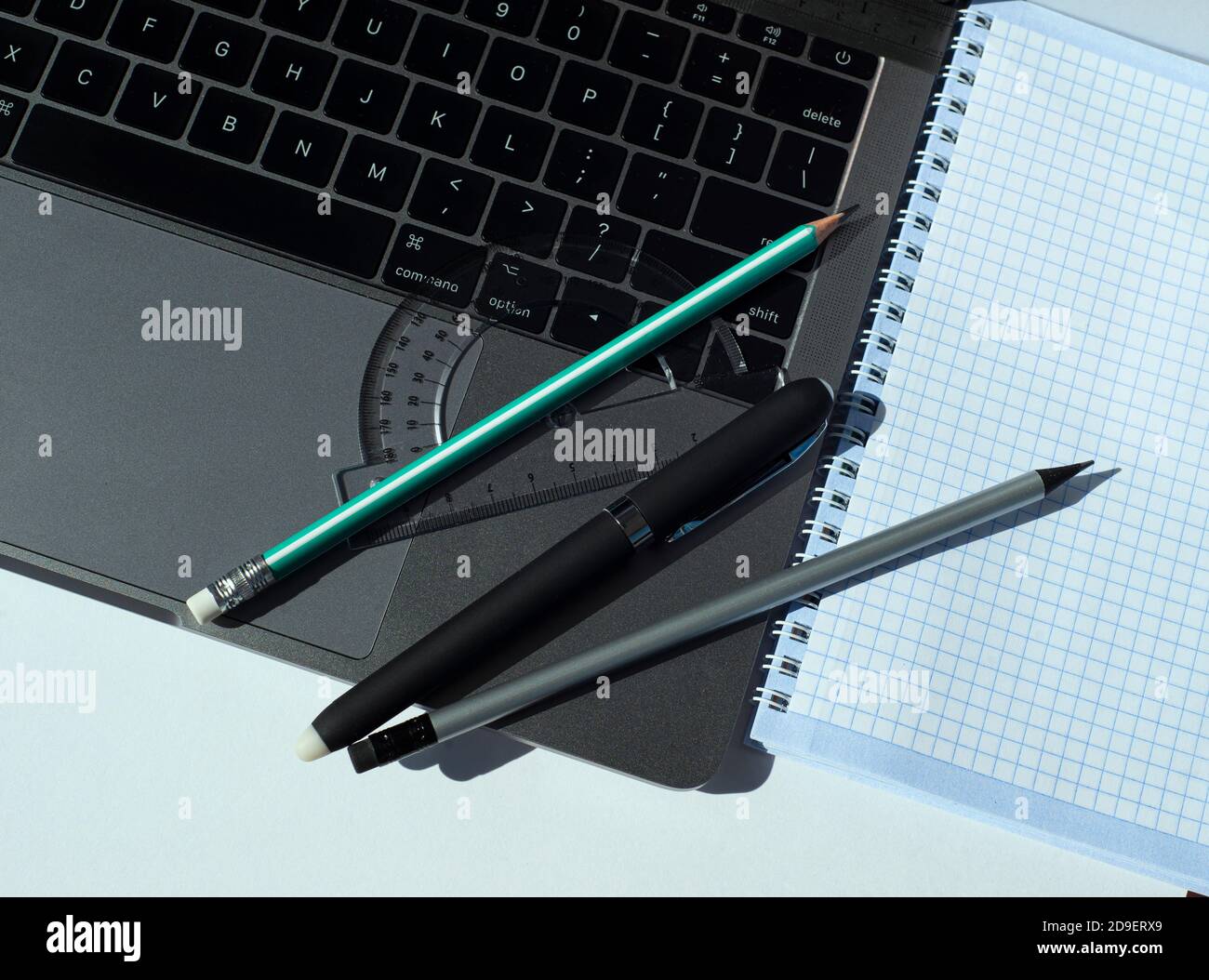 Notebook ballpoint pen pencils protractor and squared notebook. Copy ...