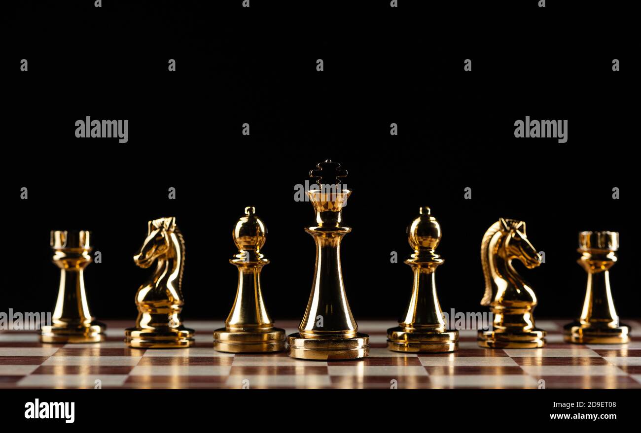 Golden chess pieces hi-res stock photography and images - Alamy