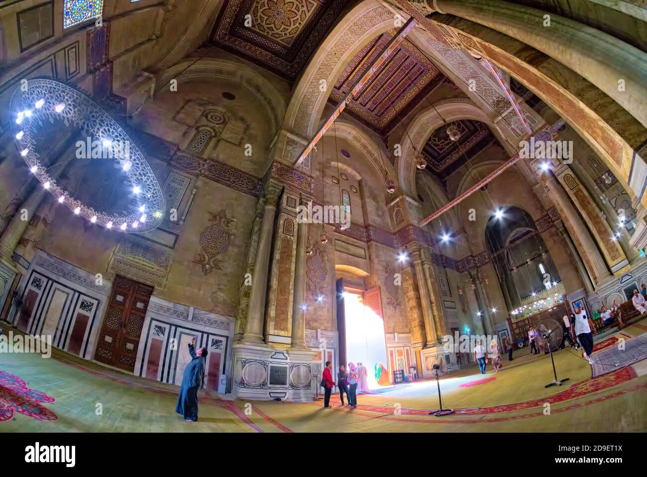 Most of the walls of the mosque are covered with colorful marble with ...